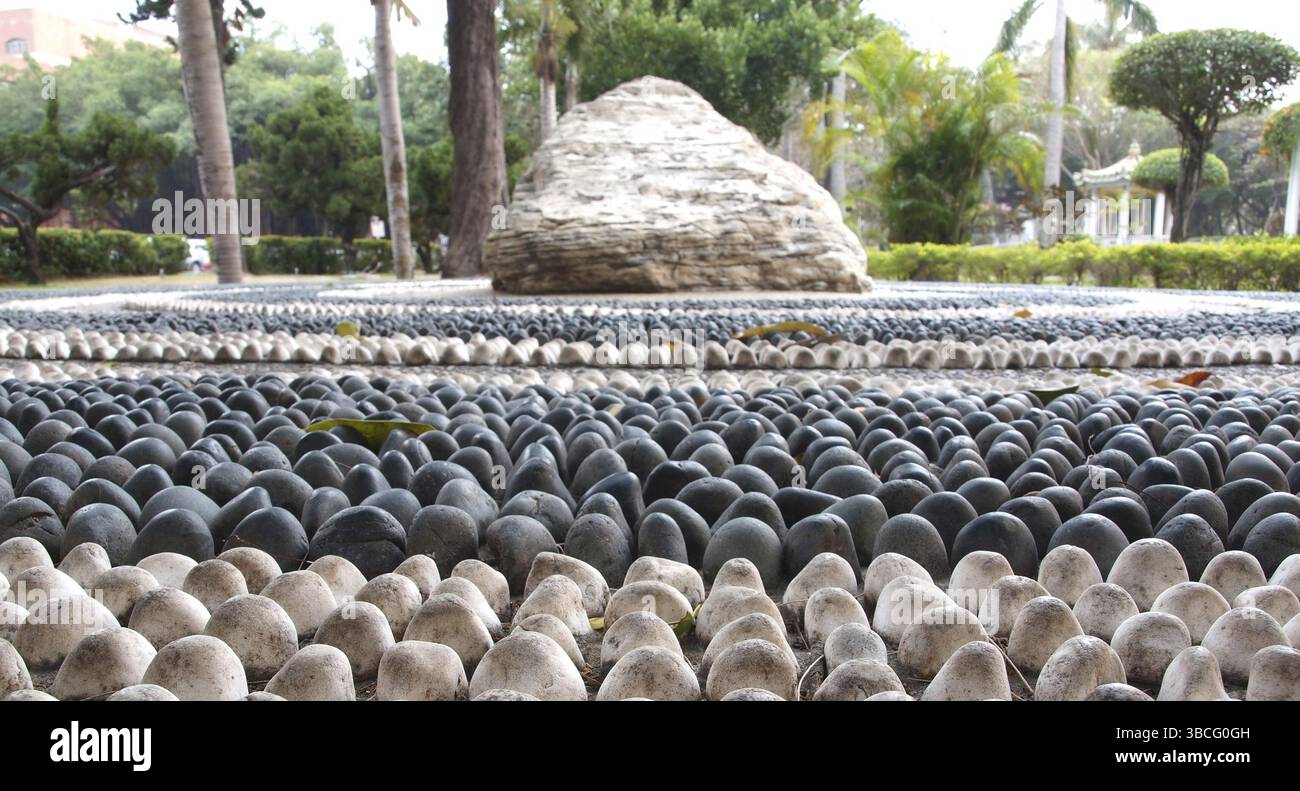 Chinese health walk made up from large pebbles in different colors ...
