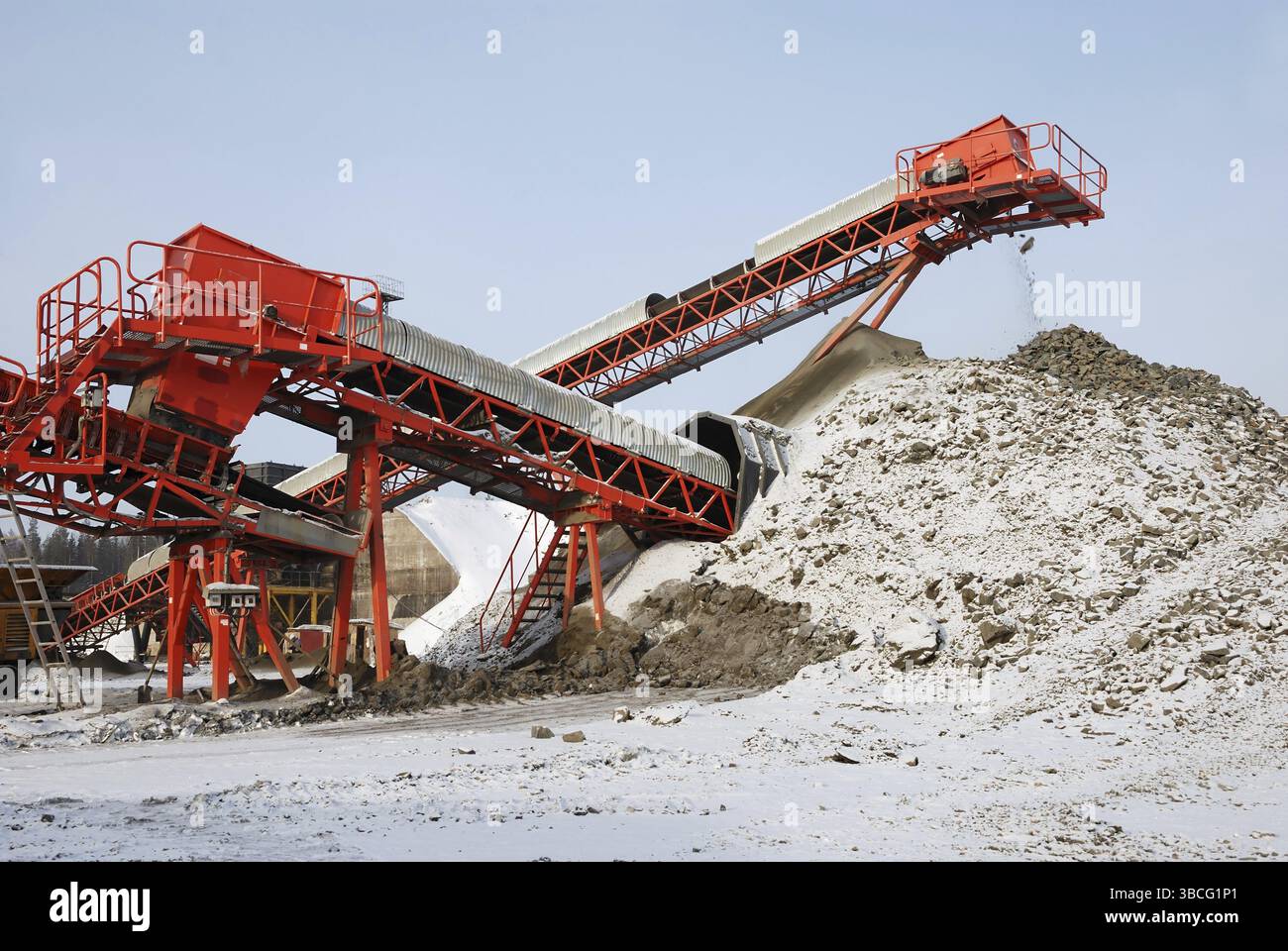 Making of crushed stone at stone quarry in winter Stock Photo - Alamy