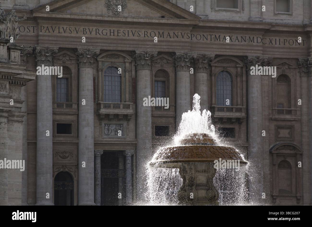 Water splashes in front of columns in water feature with text space ...
