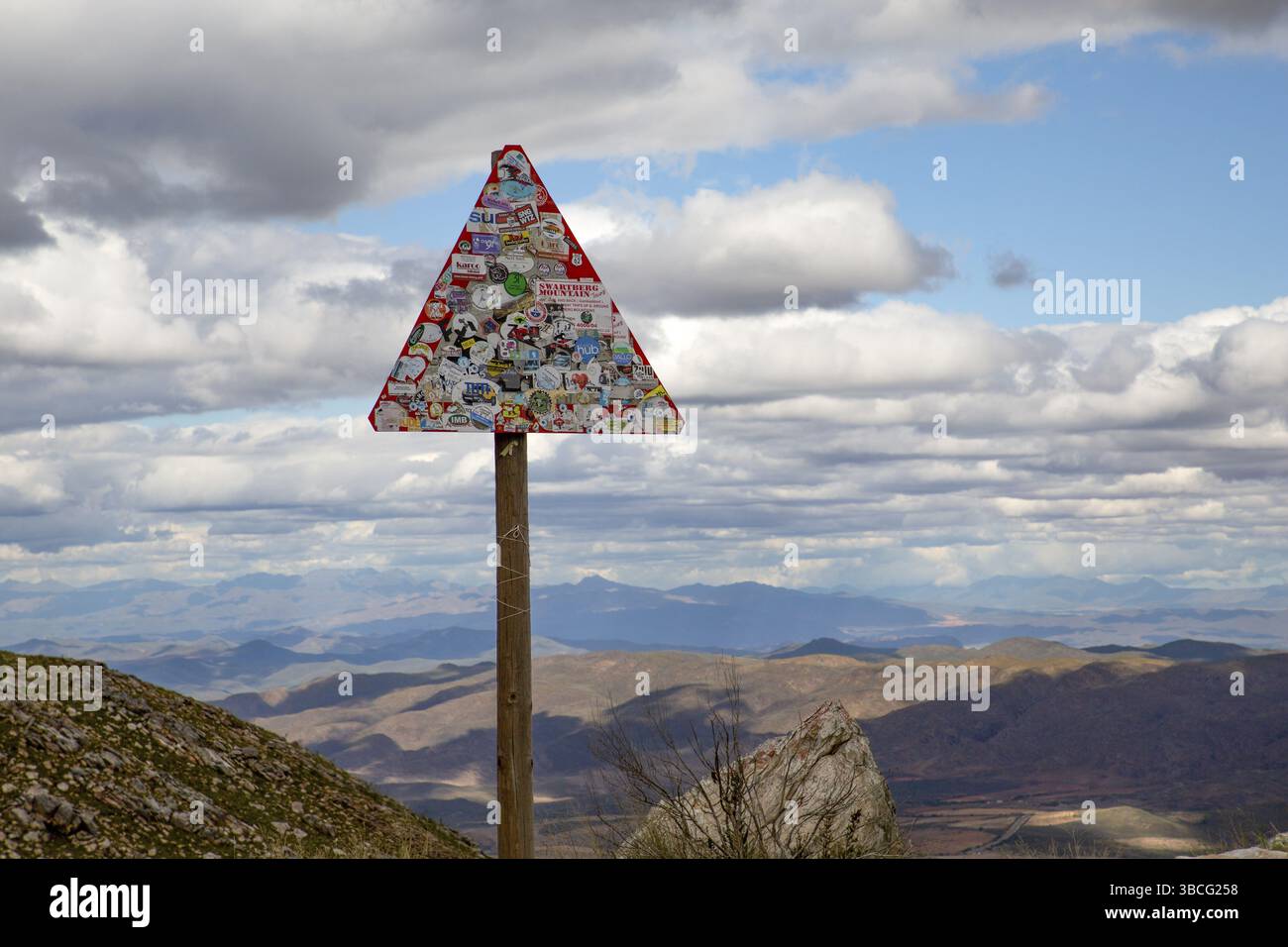 Street sign covered with stickers beyond recognition Stock Photo - Alamy