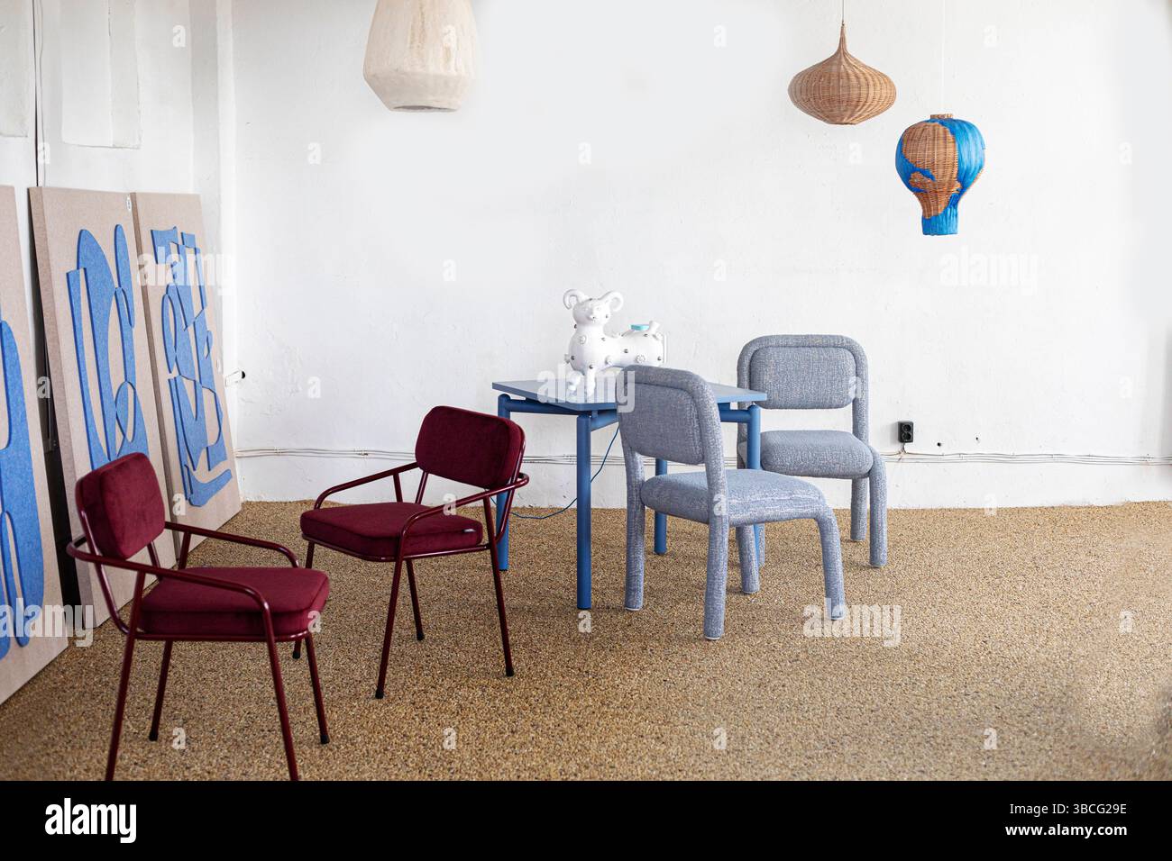 red and gray chairs with soft seats in a light modern stylish interior ...