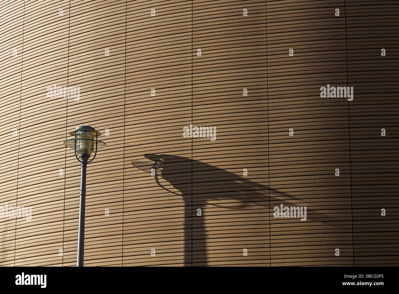 Shadow of a street light on a patterned wall Stock Photo - Alamy