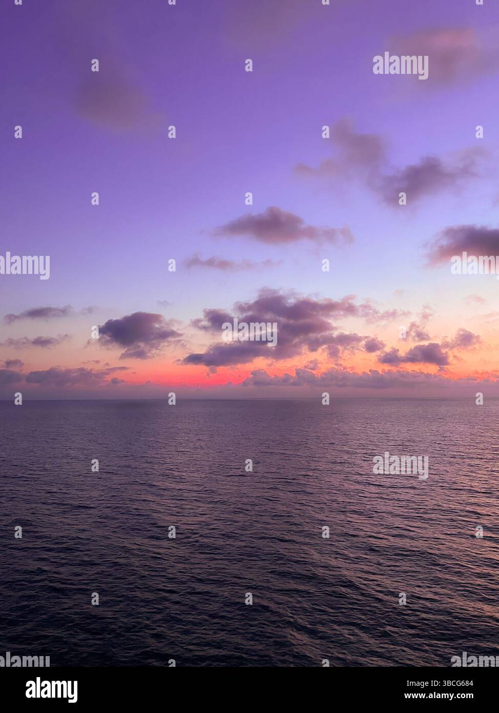 Pink clouds over sea hi-res stock photography and images - Alamy