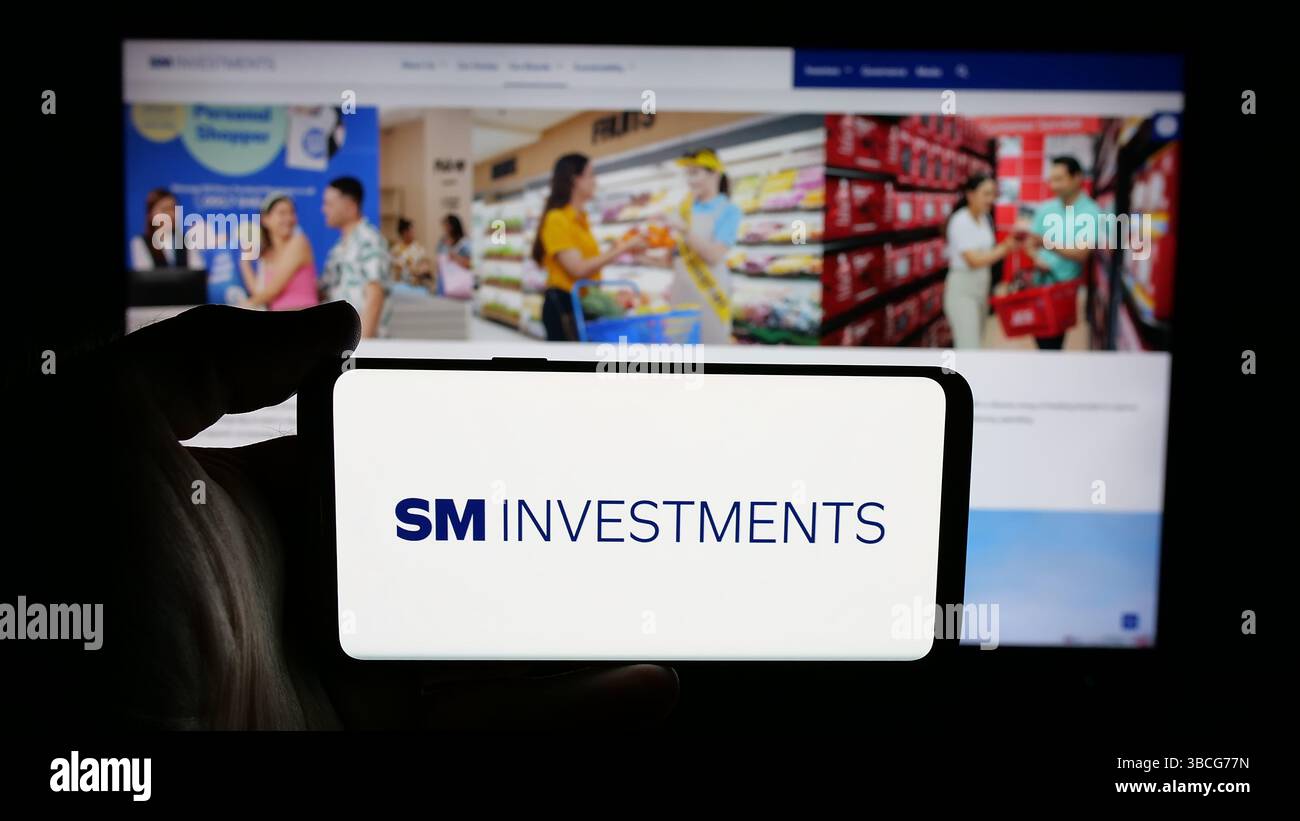 In this photo illustration, a cellphone with the logo of company SM ...