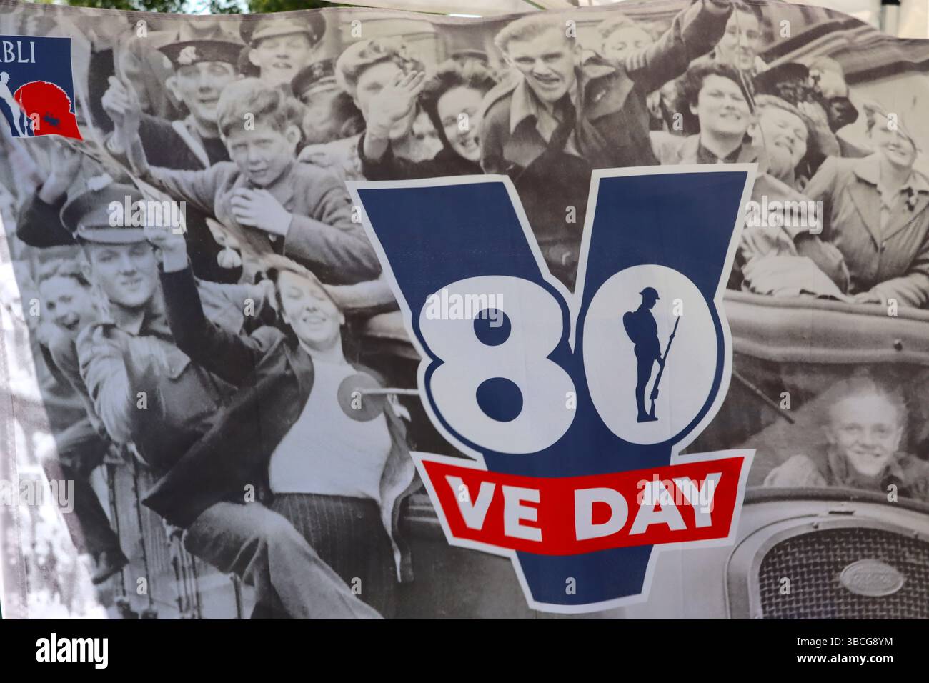 A celebratory flag flutters in the breeze commemorating the 80th ...