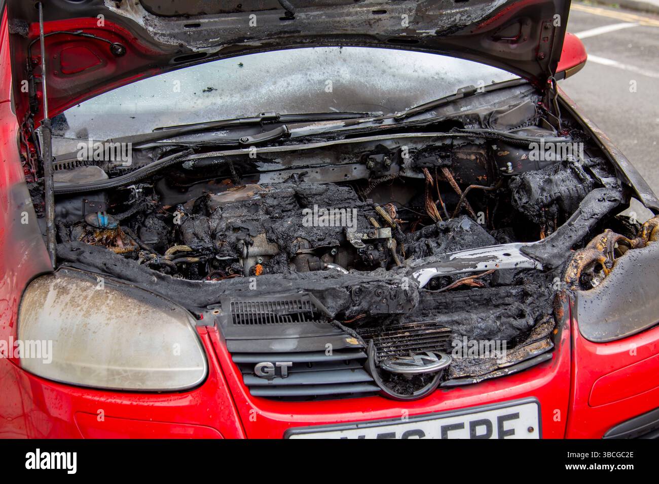 Red VW car fire burnt Stock Photo - Alamy