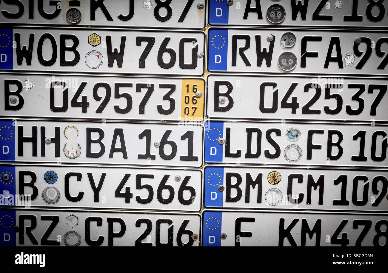 Old german number plates on a wall, with vignette Stock Photo - Alamy
