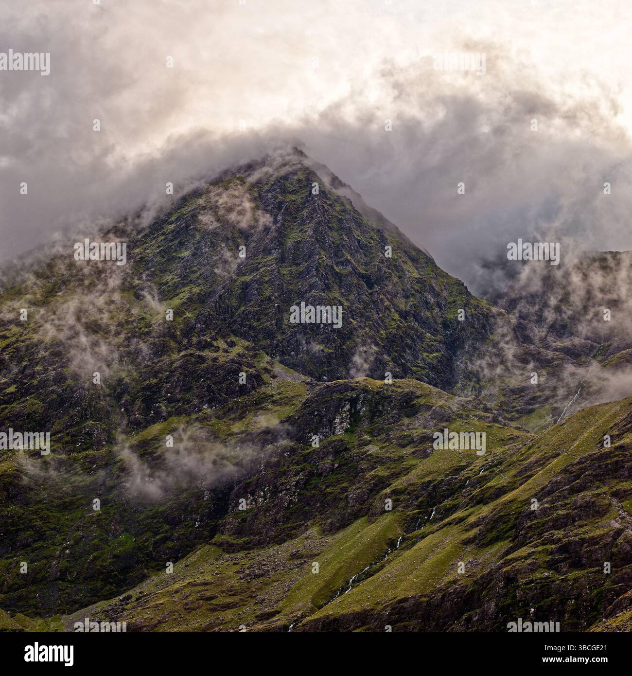Carrauntoohil, the highest peak in Ireland, looms majestically over a ...