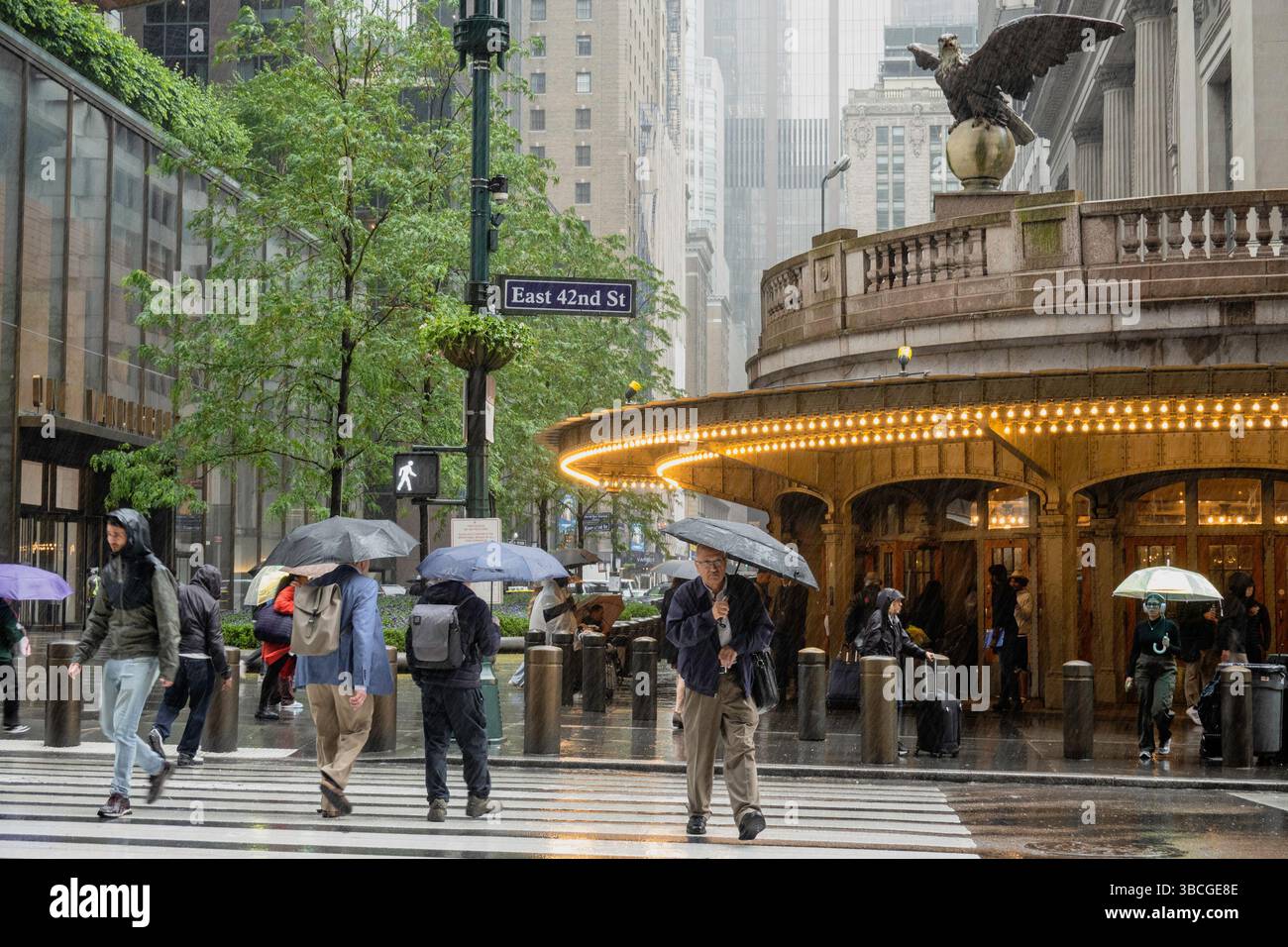 A sudden spring rainstorm sends New Yorkers and tourists scurrying around Grand Central terminal ...