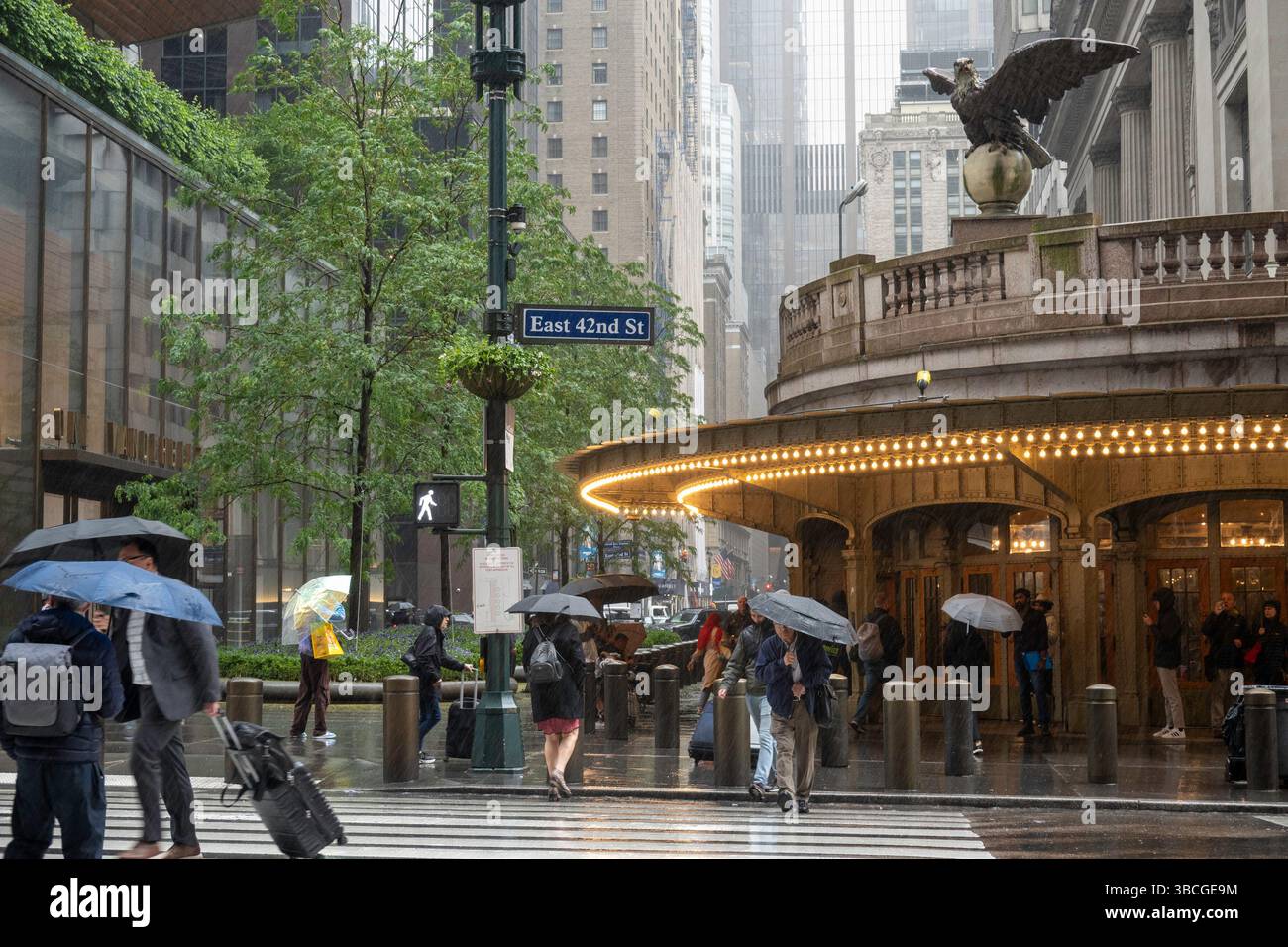 A sudden spring rainstorm sends New Yorkers and tourists scurrying around Grand Central terminal ...
