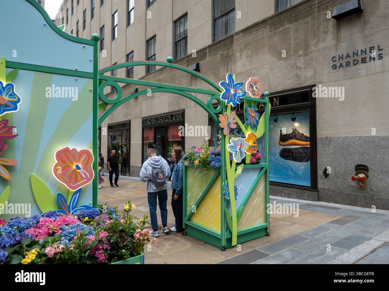 Rockefeller Center is a wash and vibrant colors with a "Spring Is ...