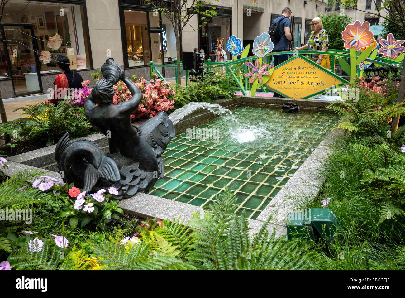 Rockefeller Center is a wash and vibrant colors with a "Spring Is ...