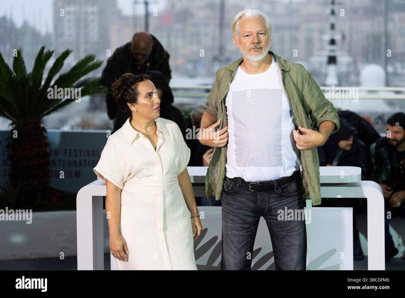 Stella Assange, left and Julian Assange pose for photographers at the ...
