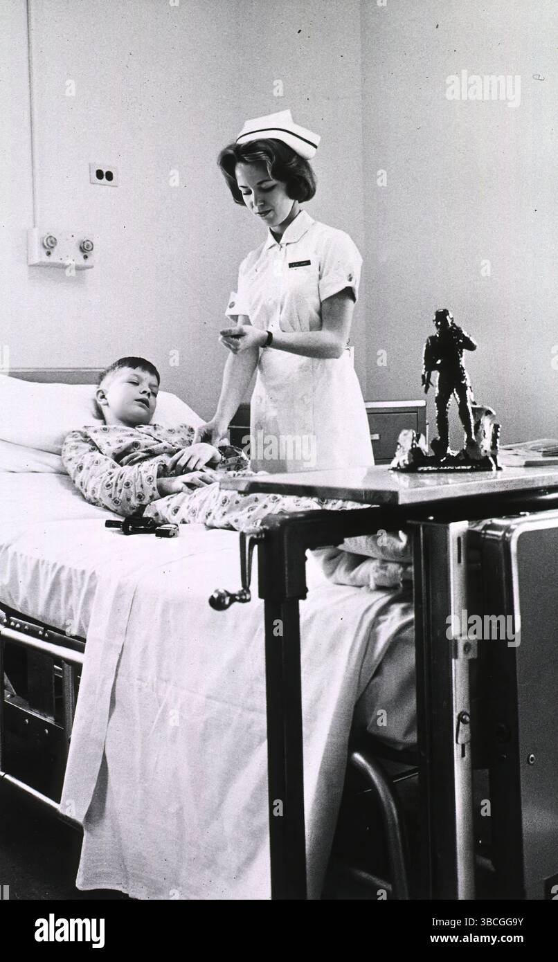 Nurse Makes Routine Pulse Check in Pediatric Ward - Historical document ...