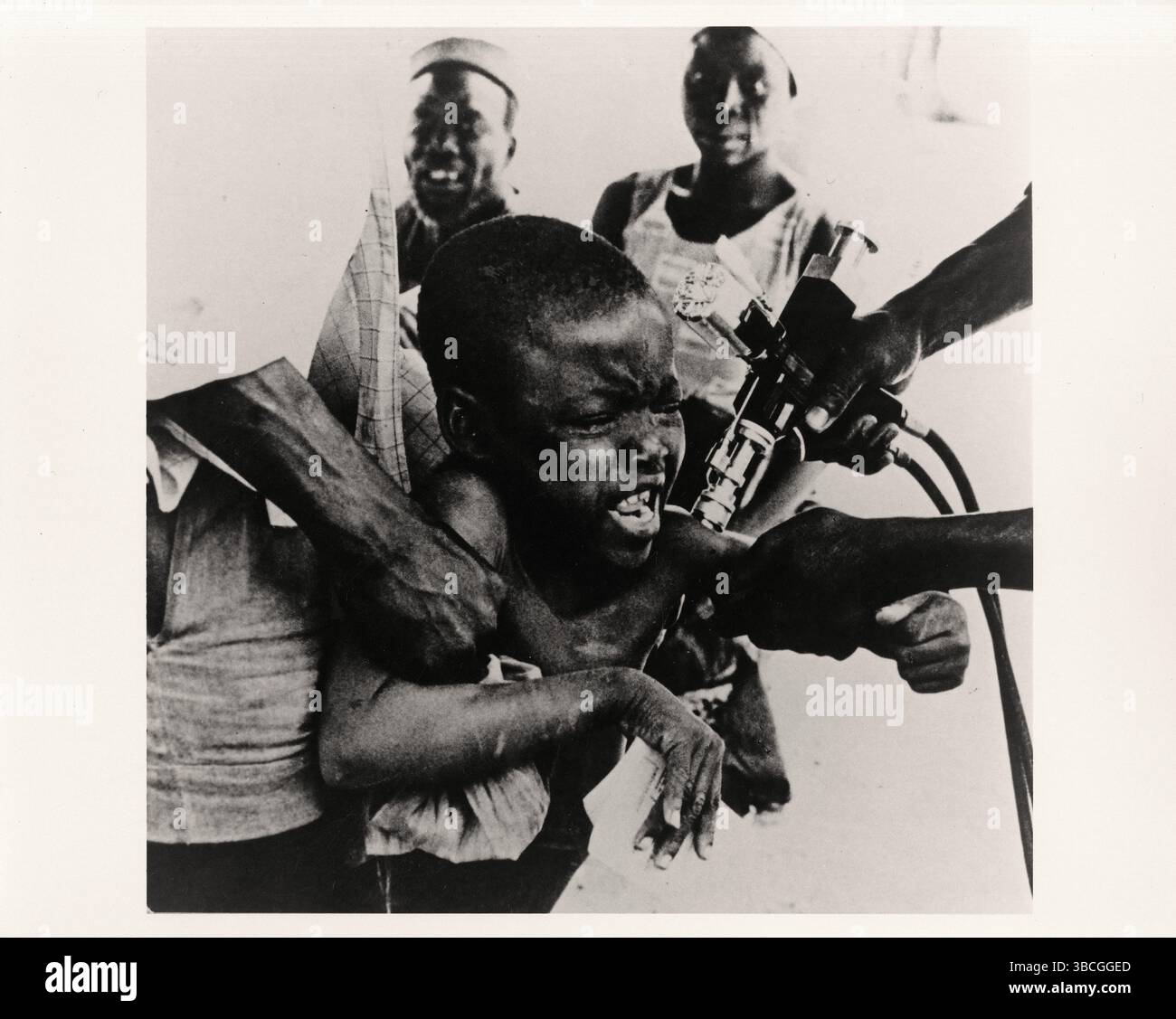 Staff Physician of the WHO Vaccinates a Youngster Against Smallpox by ...