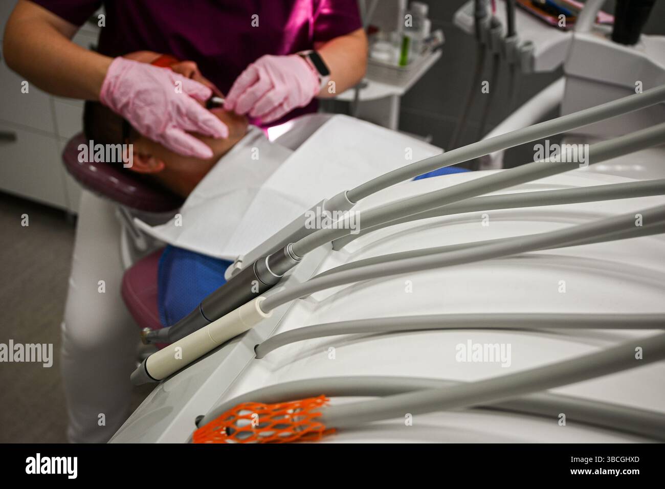 Dentist examining patient's teeth in dental clinic, providing ...