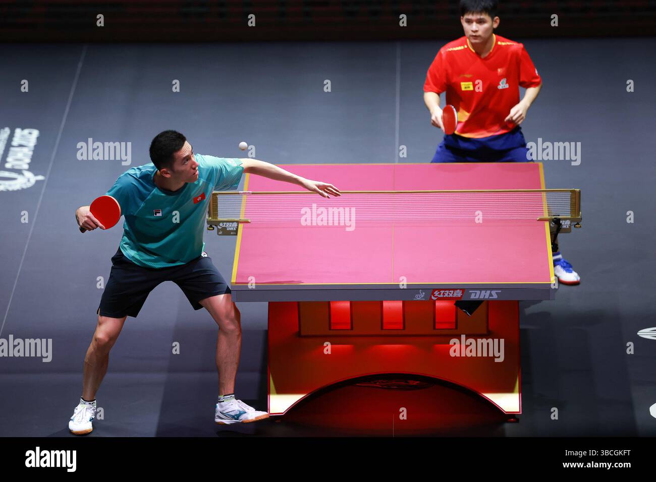 Doha, Qatar. 20th May, 2025. Lam Siu Hang (L) serves during the men's ...