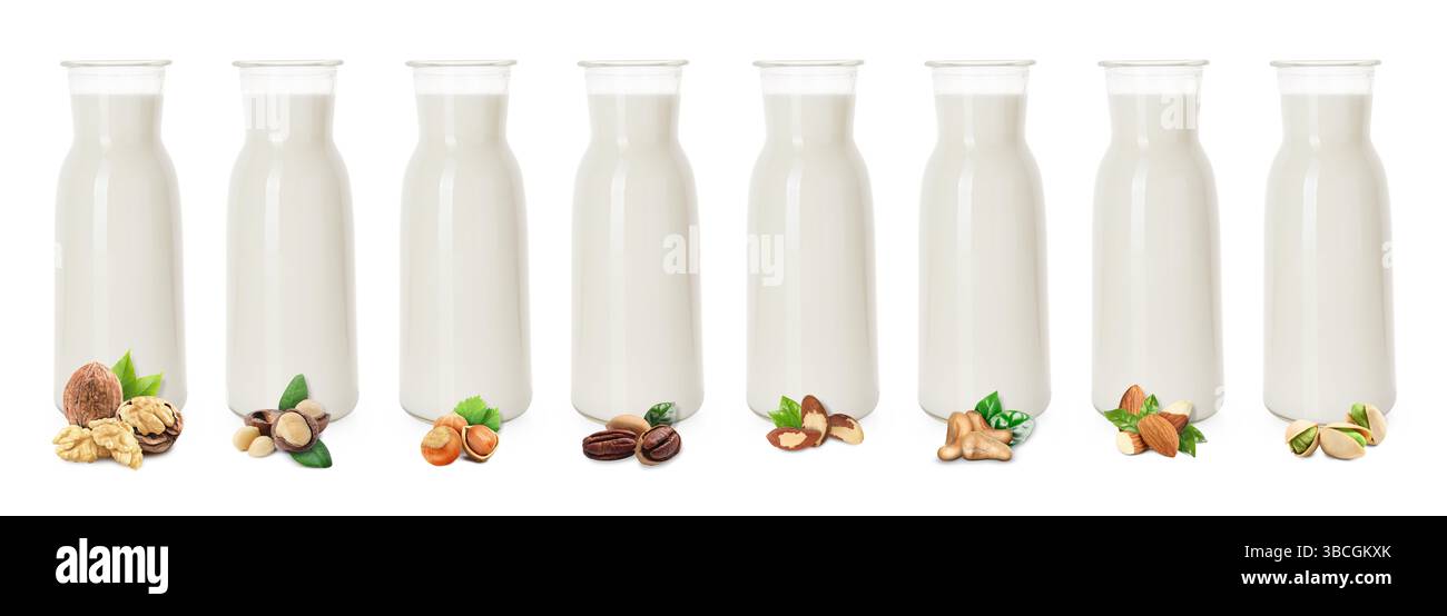 Different types of nut milk in glass bottles isolated on white, set ...