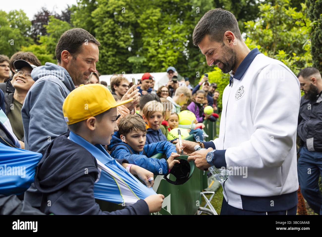 Novak Djokovic of Serbia signs autographs after a press conference at ...
