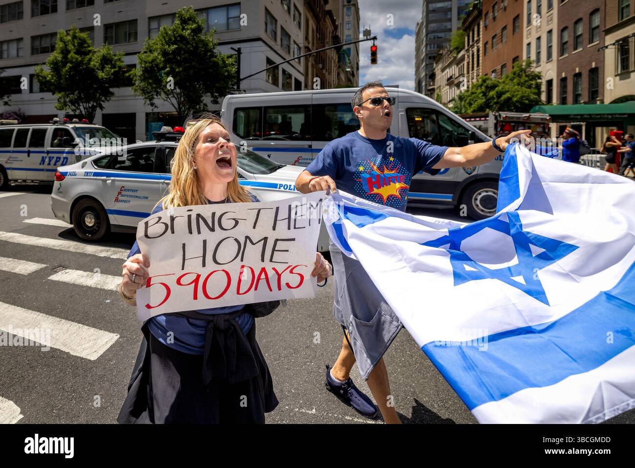 NEW YORK, NEW YORK - MAY 18: Attendees of the Israel Day parade scream ...