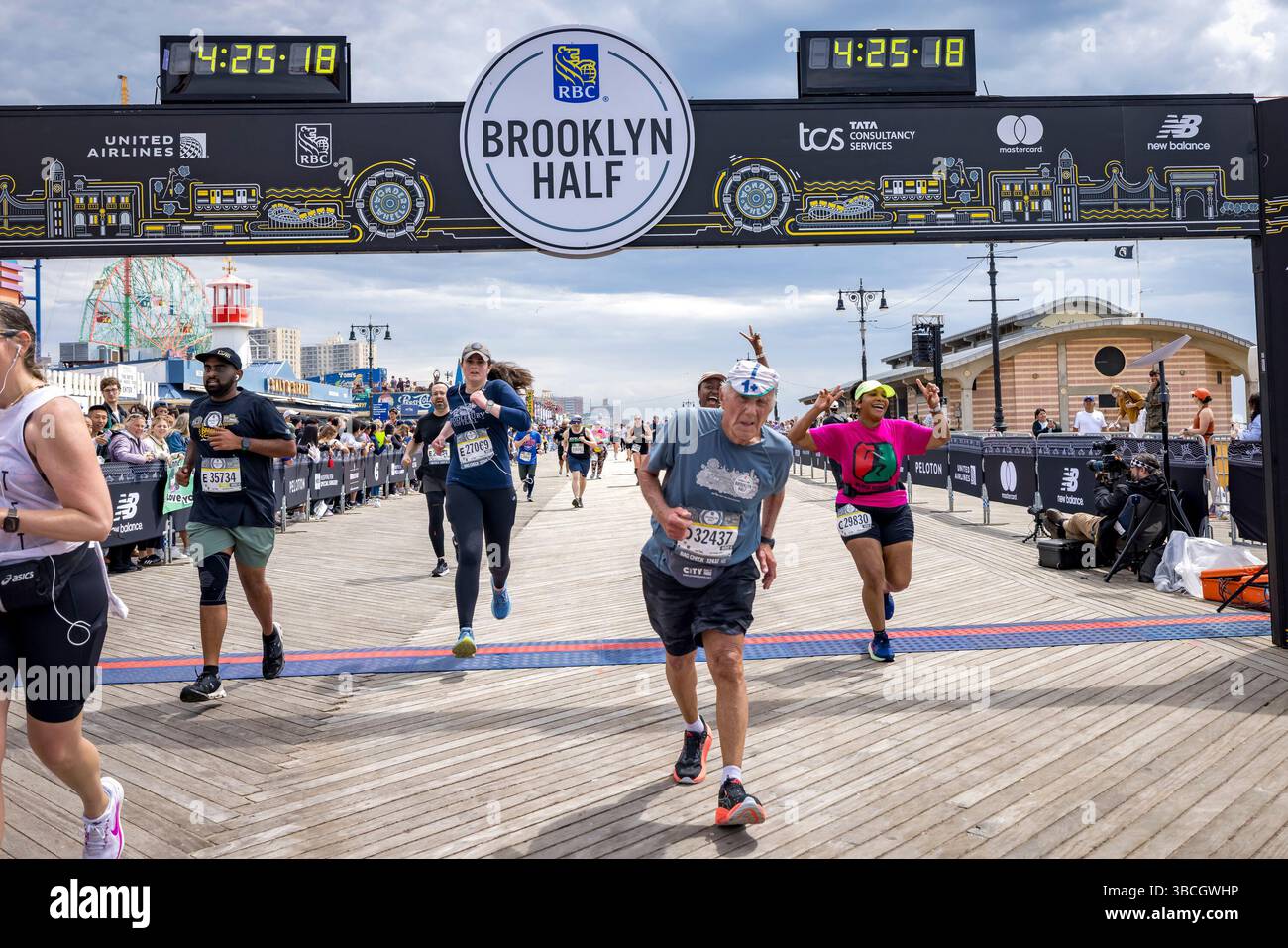 NEW YORK, NEW YORK - MAY NEW YORK, NEW YORK - MAY 17: Runners cross the ...