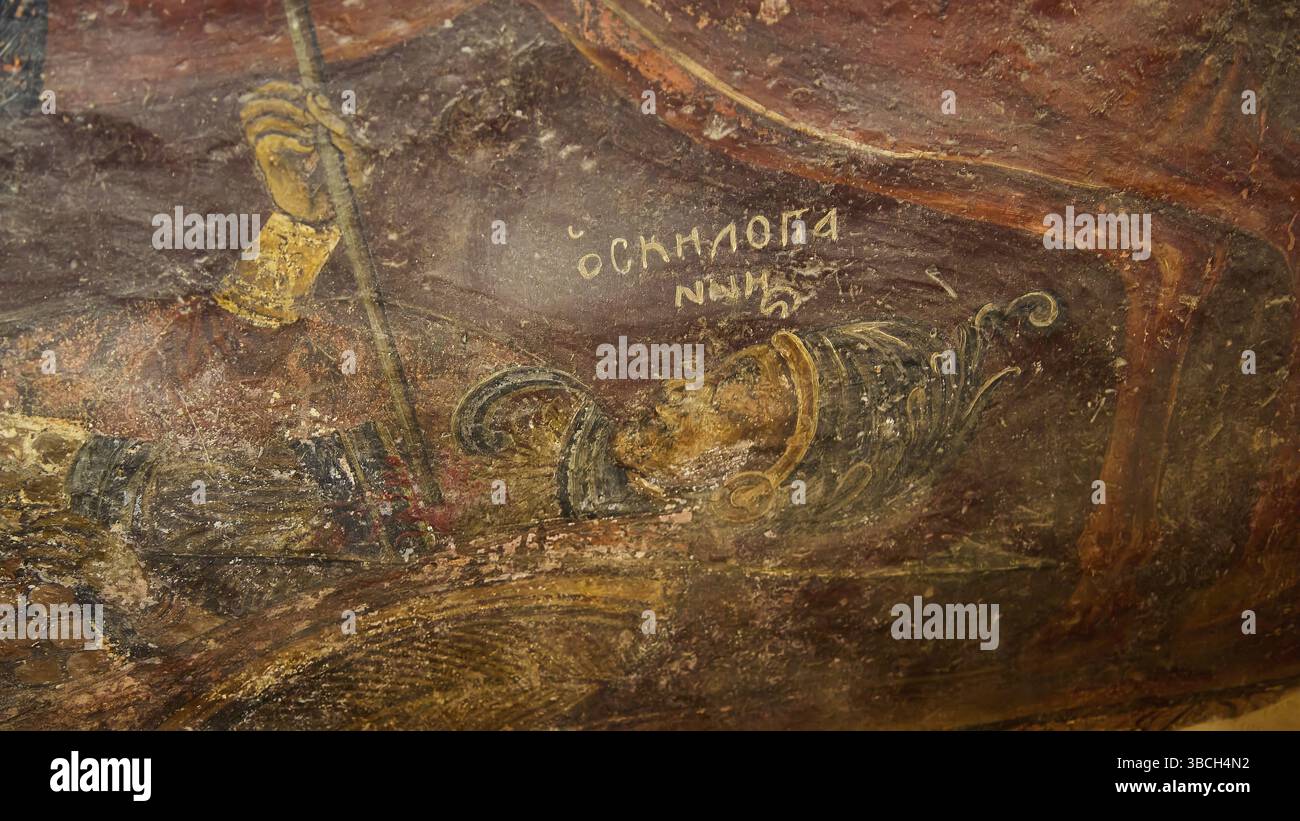 A medieval fresco shows a warrior in armour with an ornate helmet and ...