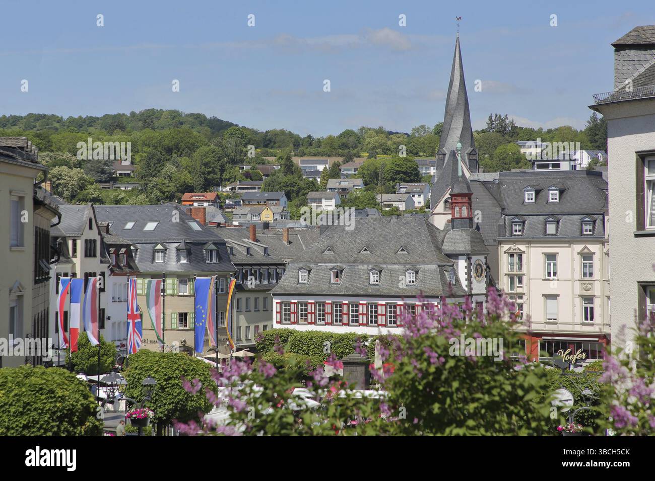 View of market square with historic town hall and twisted tower of St ...