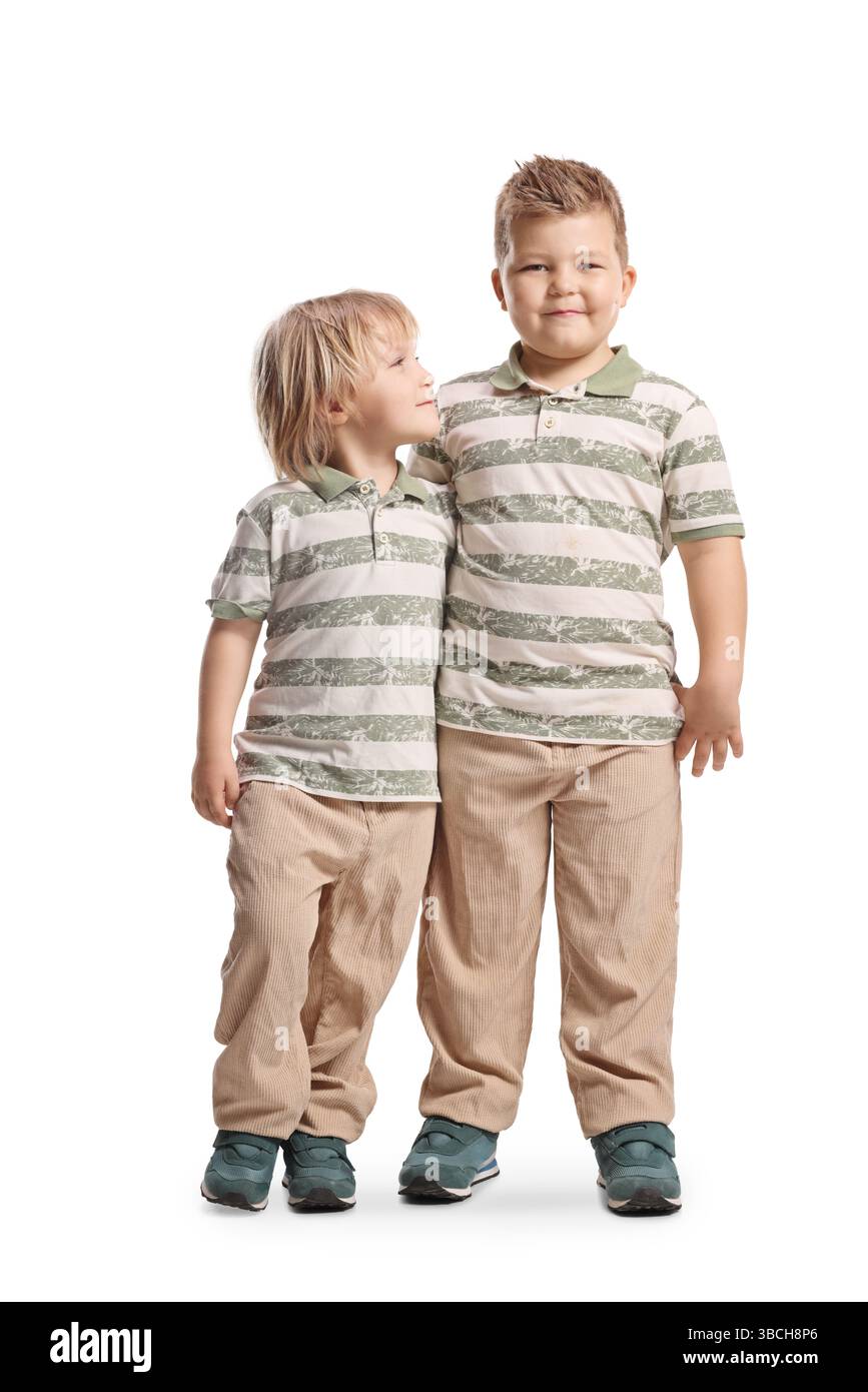 Two boys brothers in same outfit isolated on white background Stock ...