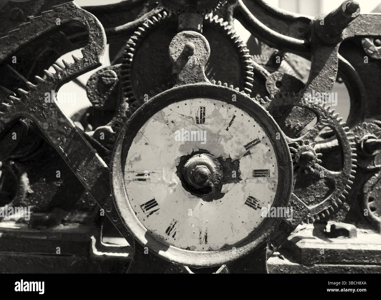 Ancient rusty broken iron clock with weathered face and exposed complex ...