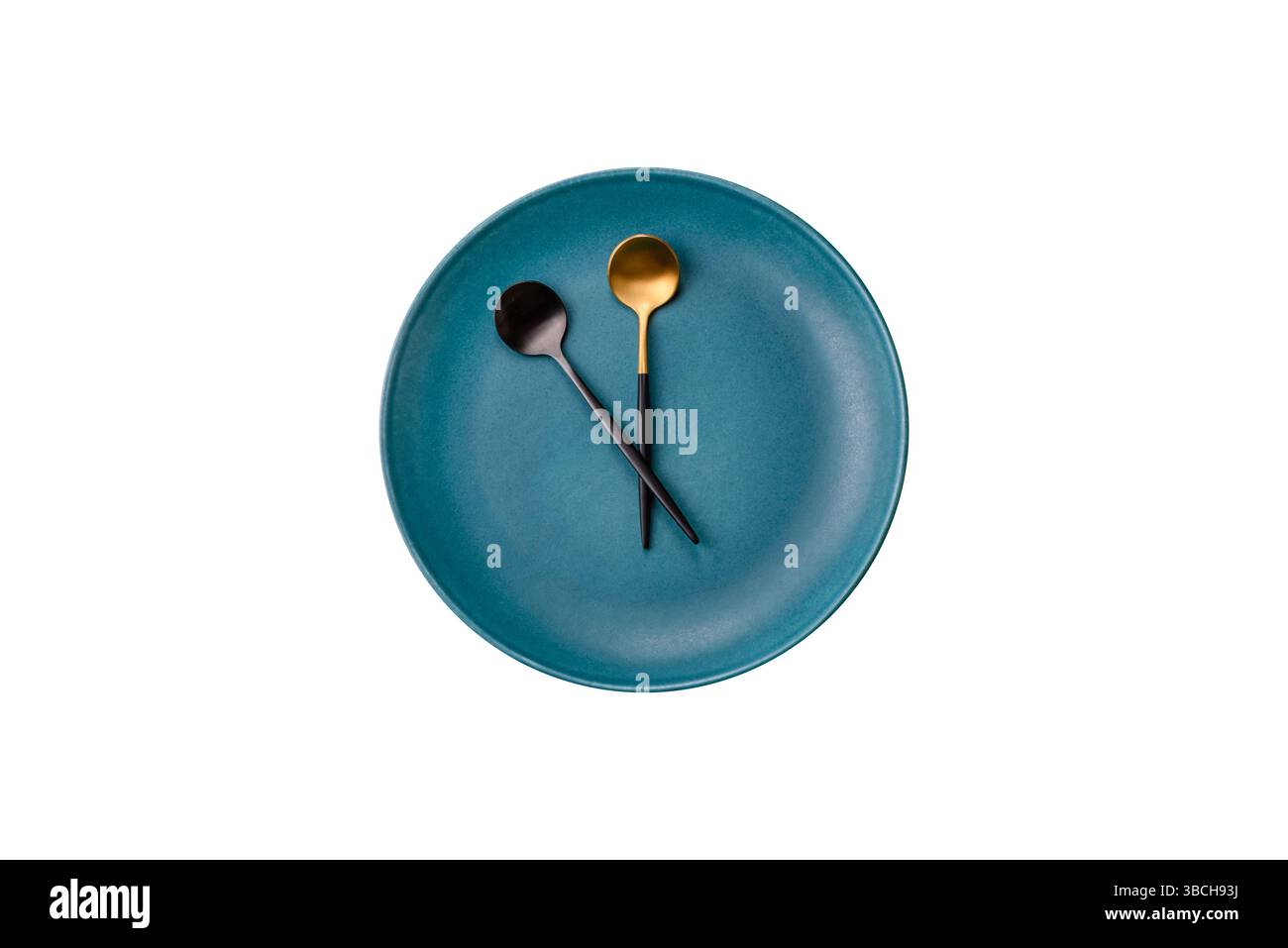 Empty plate with devices in the form of clock hands as a conceptual ...