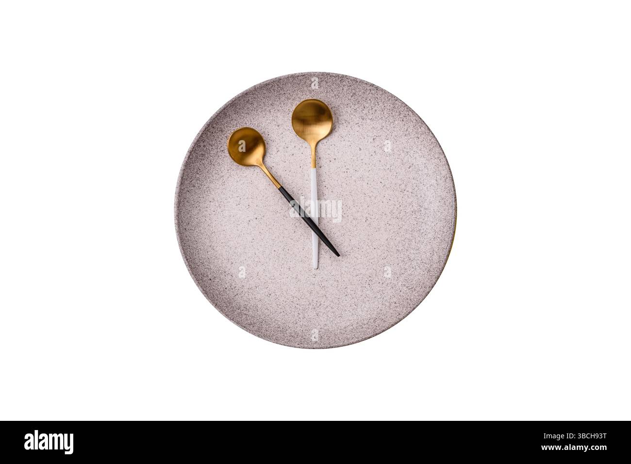 Empty plate with devices in the form of clock hands as a conceptual ...