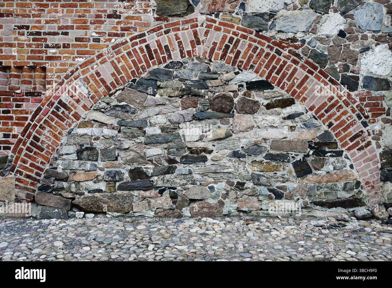 Medieval wall of stone and bricks, cobblestones Stock Photo - Alamy