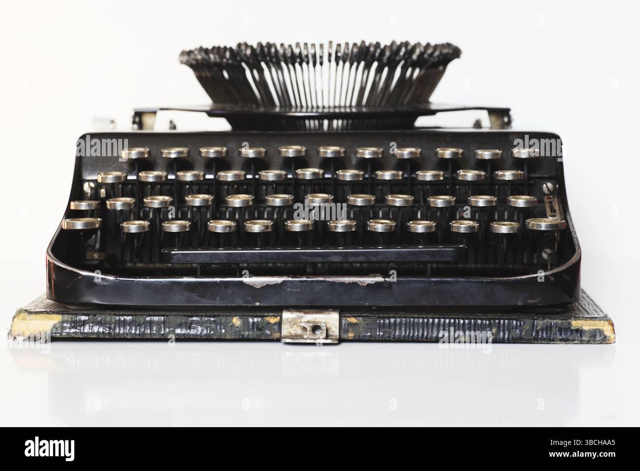 Ancient portable typewriter over white background, front view Stock ...