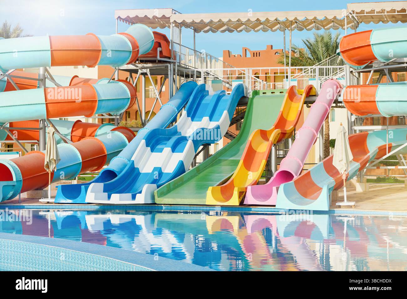Water park with water colored flights, slides, splashes and pools at ...