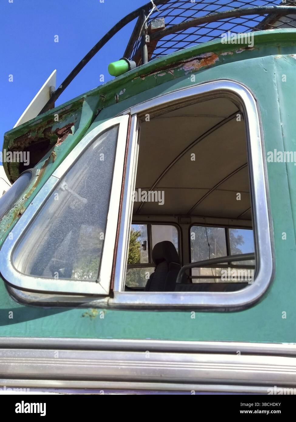 Close up of the side window of an old green rusty vintage bus Stock ...