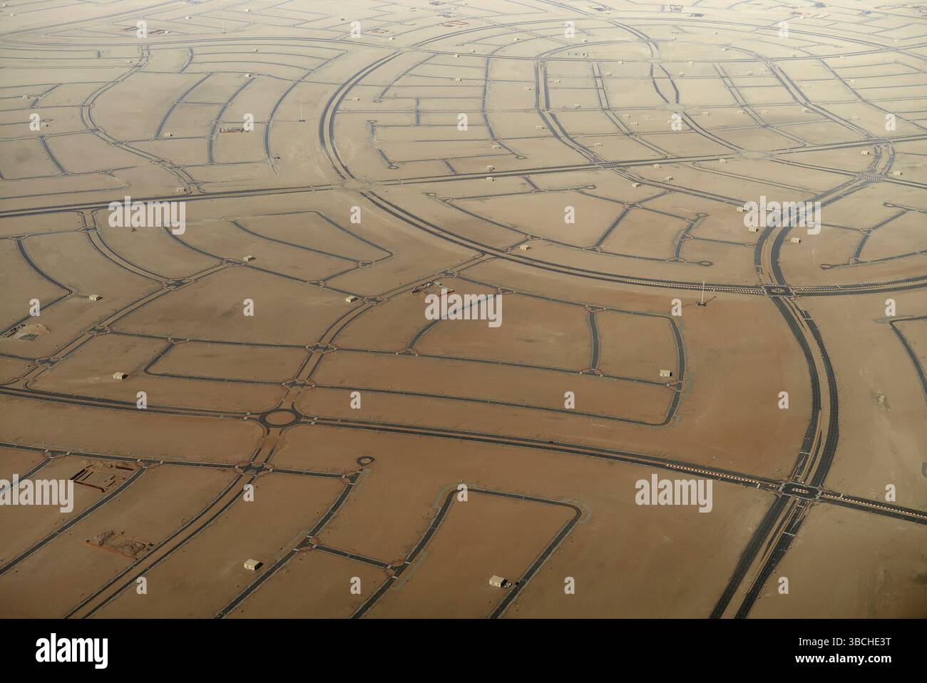 Aerial view of desert land divided into marked plots for development ...