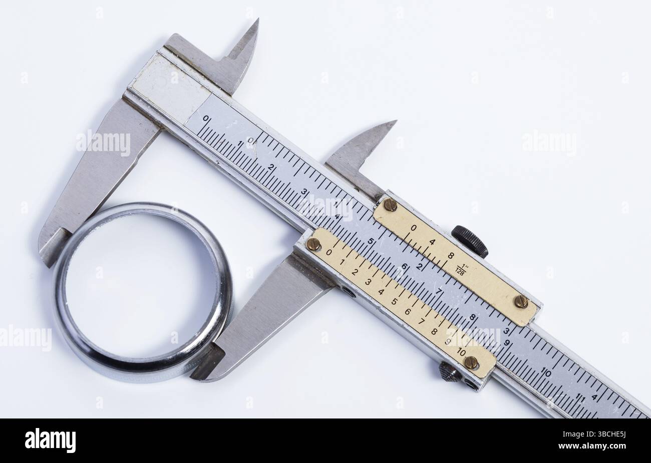 Image shows a caliper and a screw Stock Photo - Alamy
