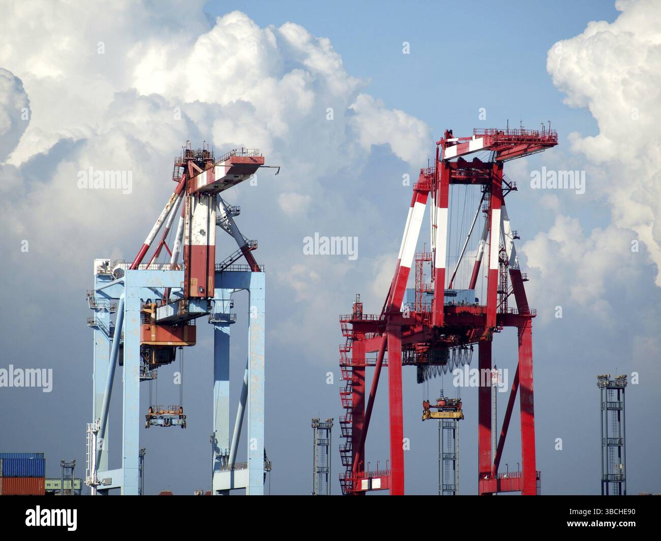 Close view of two large gantry cranes used to load shipping containers ...