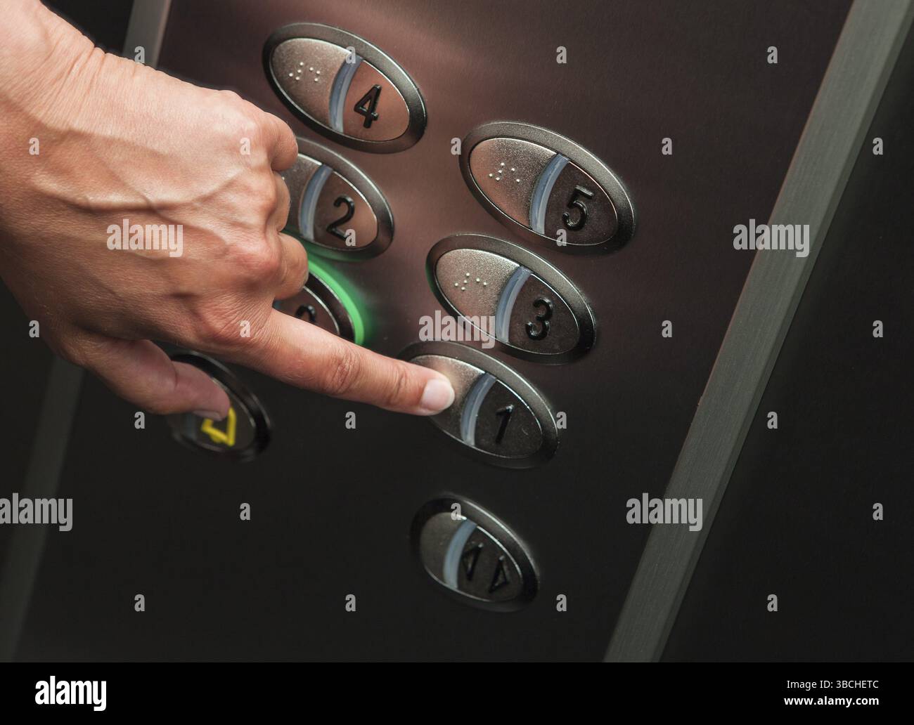 Woman's hand is pressing the first floor in a elevator Stock Photo - Alamy