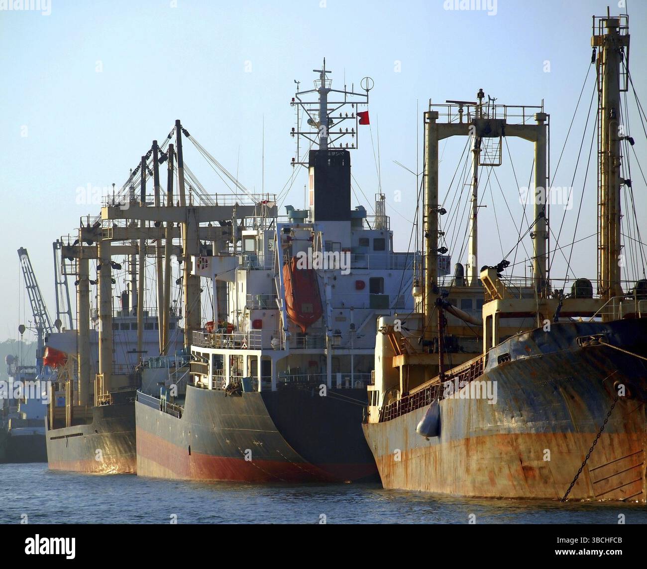 A row of cargo vessels is anchored at Kaohsiung Port Stock Photo - Alamy
