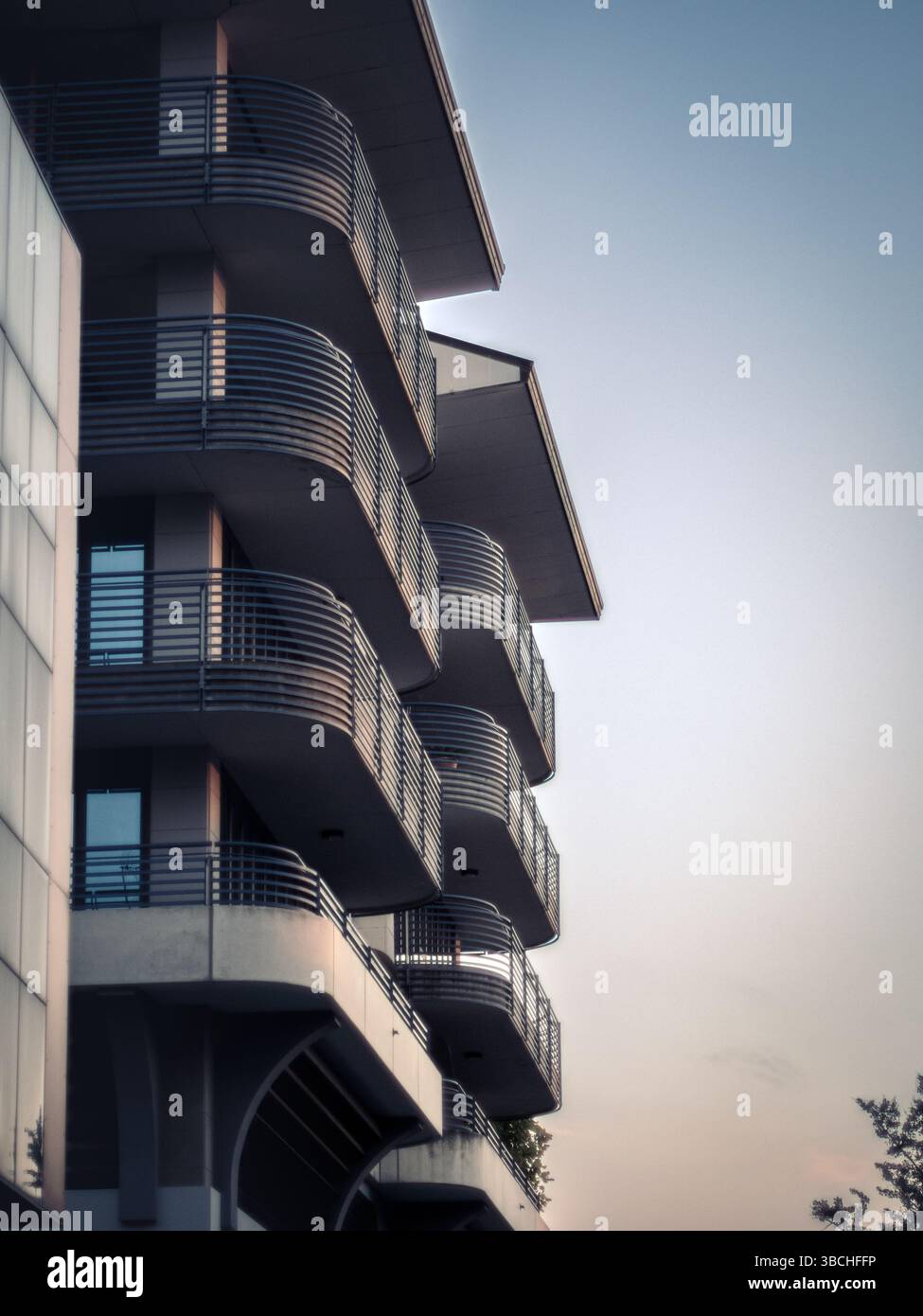 Contemporary hotel facade featuring sleek balconies and large glass ...