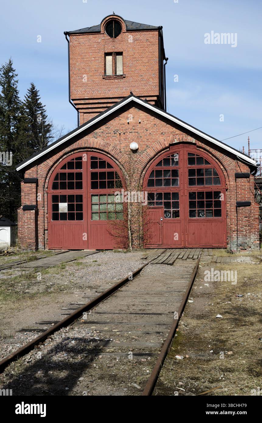Old brick building locomotive depot with arched windows Stock Photo - Alamy