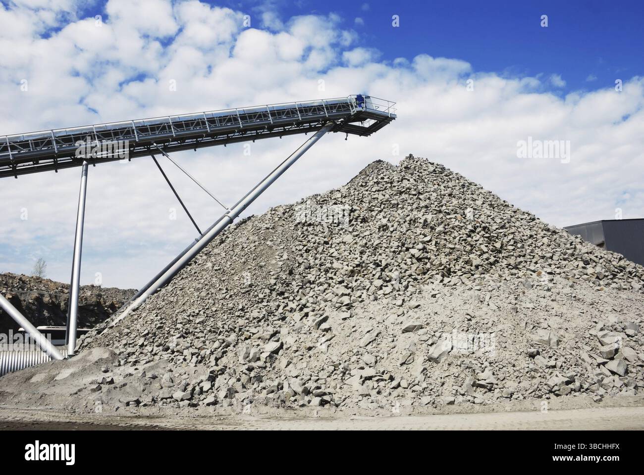Making of crushed stone at stone quarry Stock Photo - Alamy