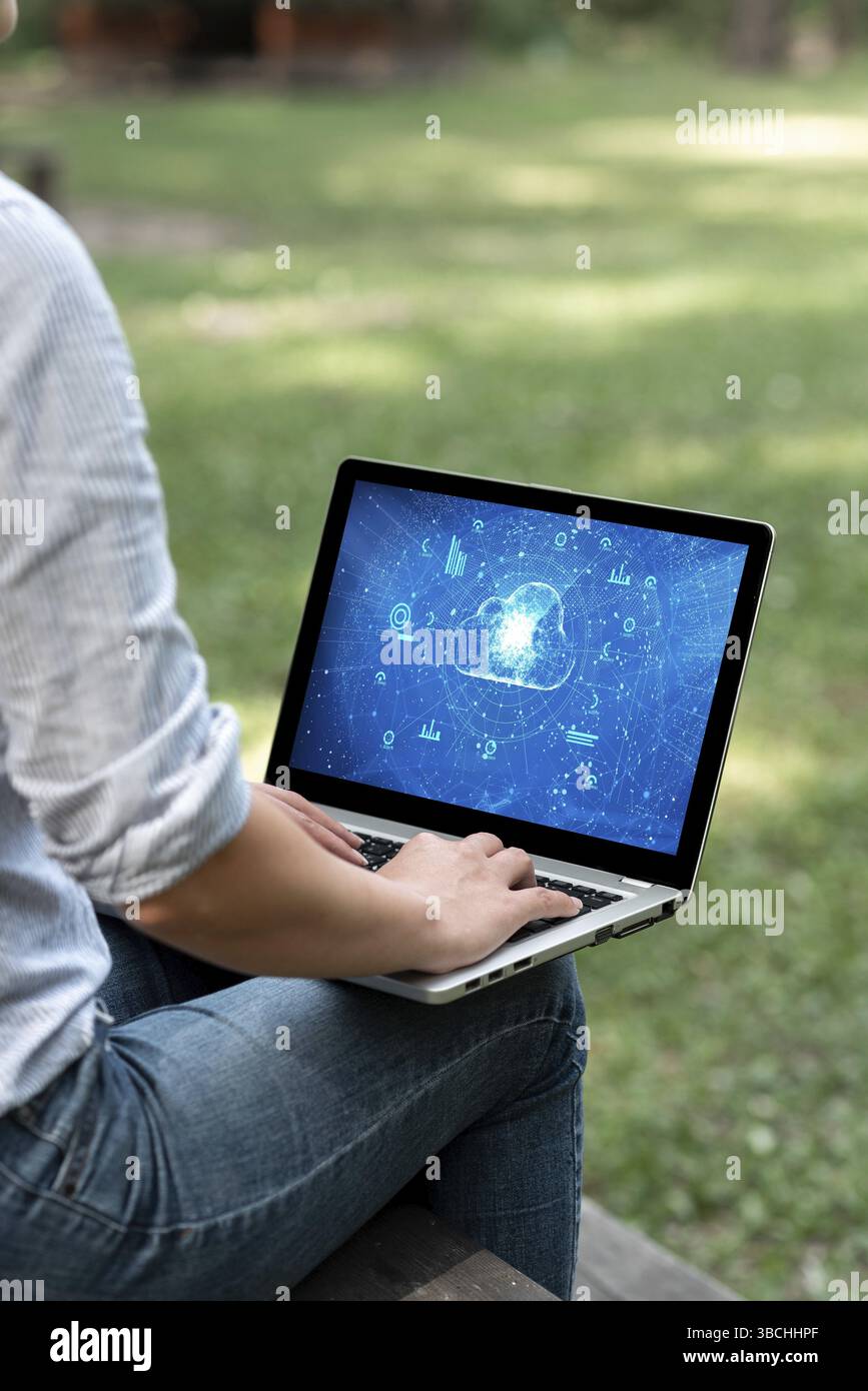 Woman Typing On Laptop Sitting Outside Side View Working From Home ...