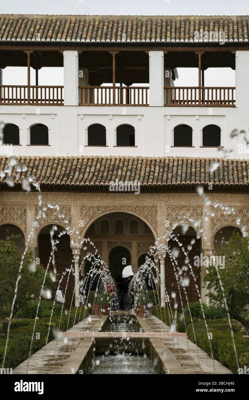 Fountain with symmetrical water feature in Alhambra garden Stock Photo ...