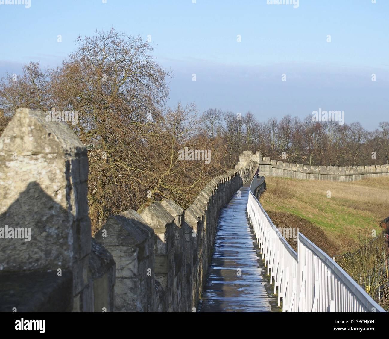 A view along the pedestrian walkway on historic medieval city walls in ...