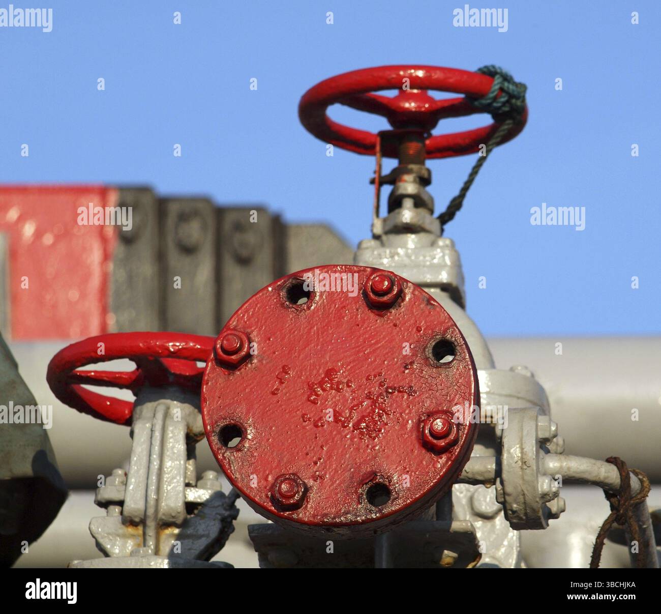 Valves and pipes at an oil installation Stock Photo - Alamy