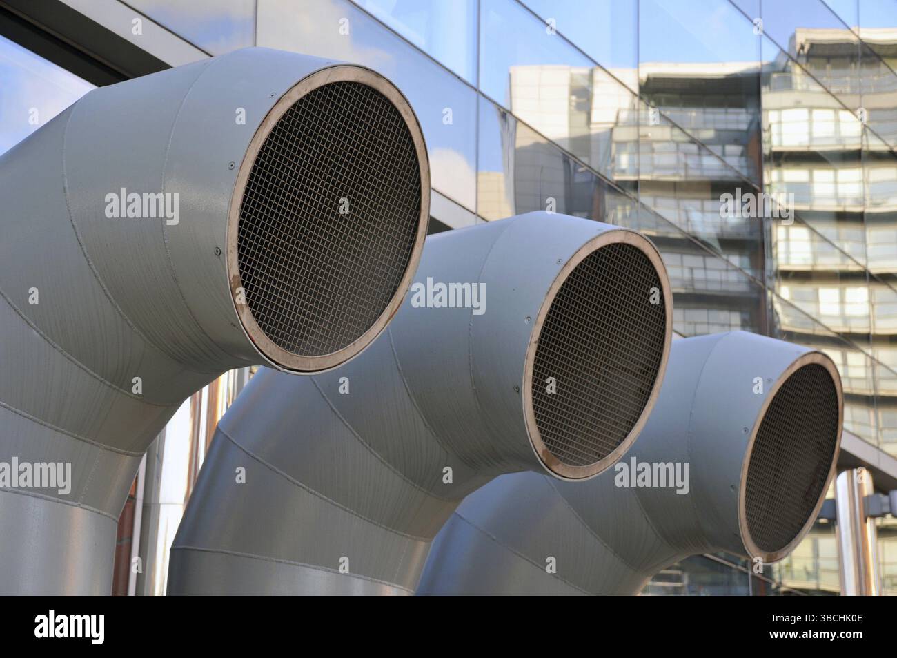 Funnel shaped ventilation ducts on a modern building Stock Photo - Alamy