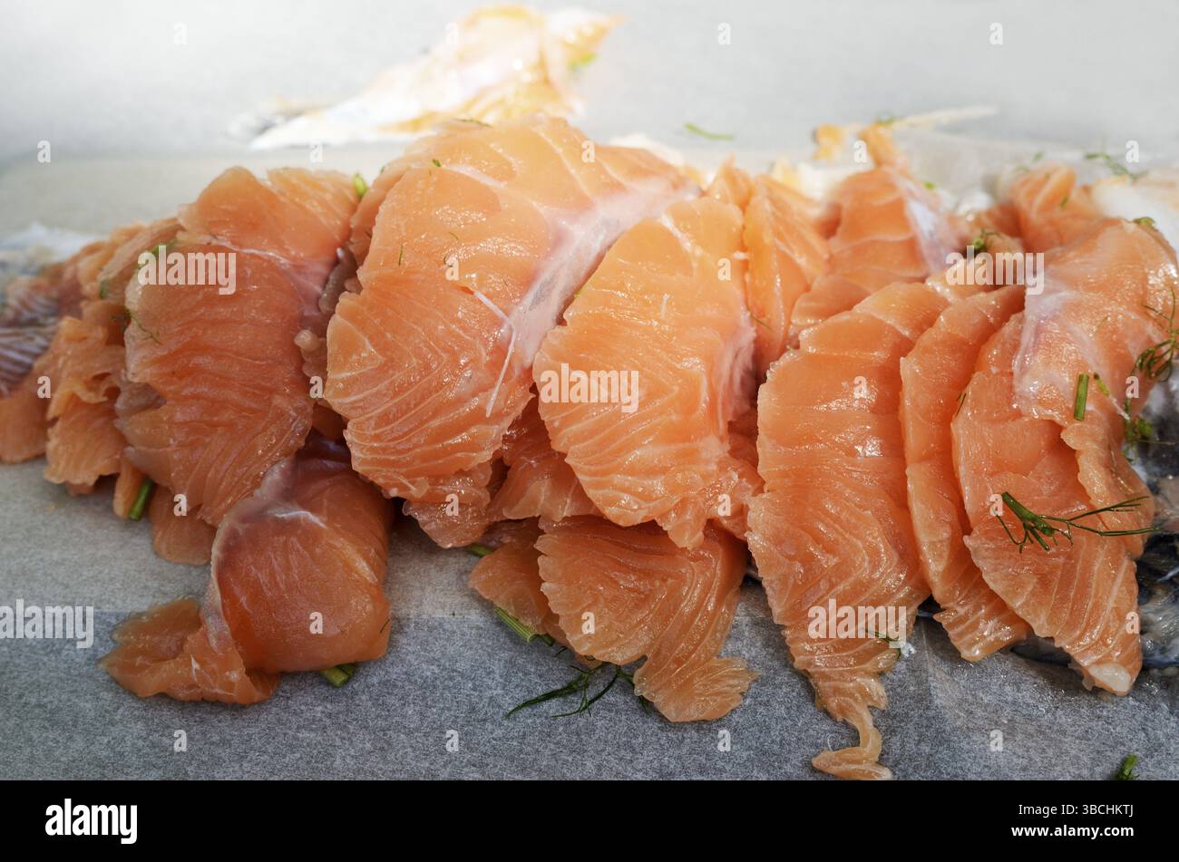 Sliced salted salmon fillet on paper, horizontal Stock Photo - Alamy