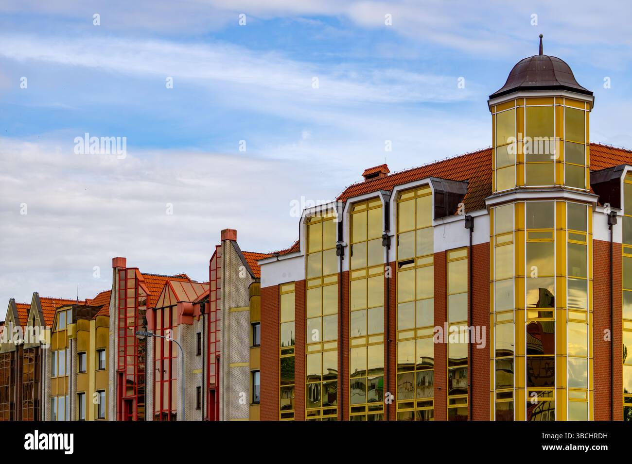 Modern urban architecture with distinctive facades and large golden ...